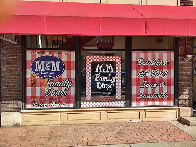 That cheerful red awning beckons like a lighthouse for hungry souls navigating downtown Logan's streets.