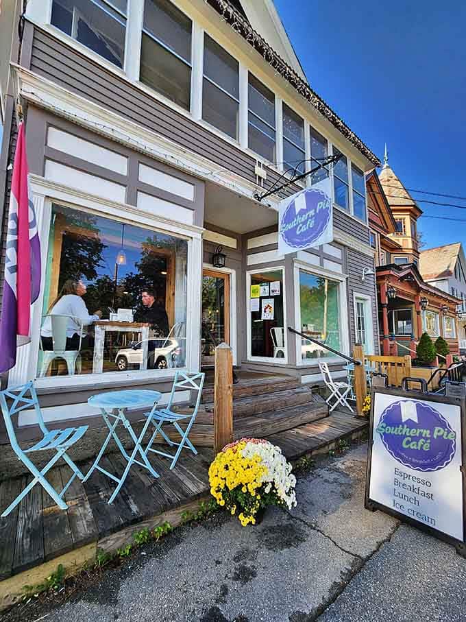 That purple and white sign beckons like a breakfast beacon, promising comfort food and small-town charm in equal measure.