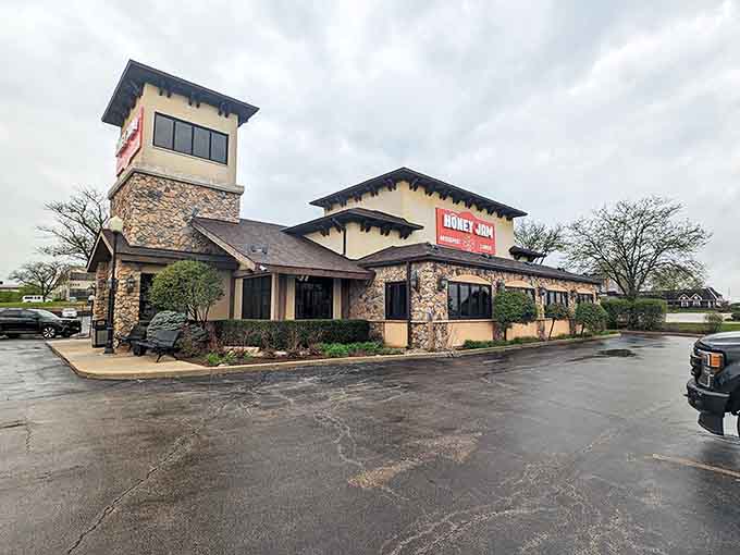 Stone and stucco exterior welcomes you like a cozy cottage, promising comfort food adventures inside.