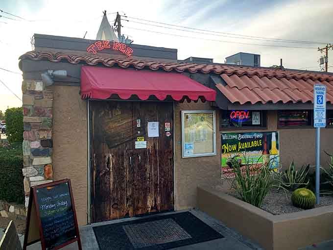 That rustic wooden door and cheerful pink awning signal you've arrived at Phoenix's cheese crisp headquarters, where tortillas meet their delicious destiny.
