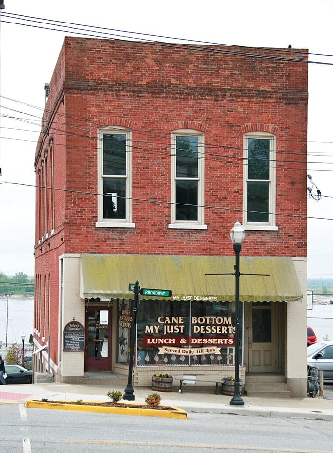 That cheerful yellow awning beckons like a lighthouse for the lunch-hungry, promising homemade goodness inside this historic Alton brick building.