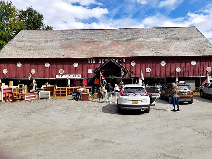The iconic crimson exterior of Big Red Barn stands proudly against the Vermont sky, a beacon for treasure hunters and nostalgia seekers alike.