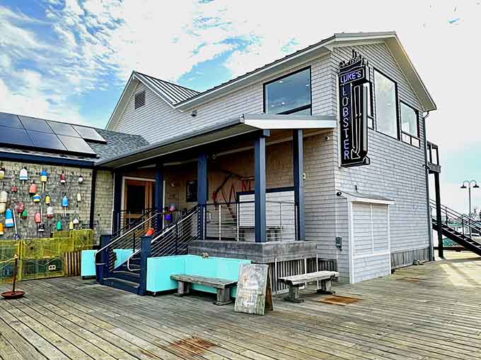 That vintage neon sign and turquoise bench combo screams "classic Maine waterfront," like a postcard come to life with better food.