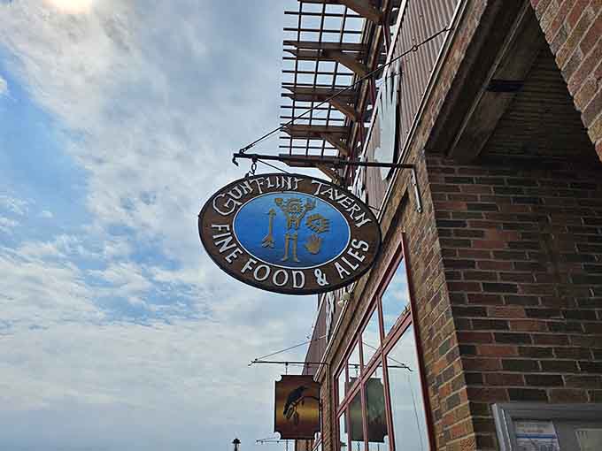 That charming sign beckons like a lighthouse guiding hungry travelers to their delicious destiny along Grand Marais's harbor.