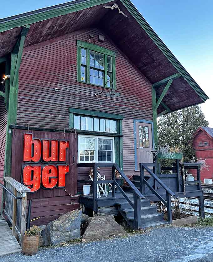 That red "burger" sign against weathered wood is basically Vermont's way of saying "good food lives here, come on in."