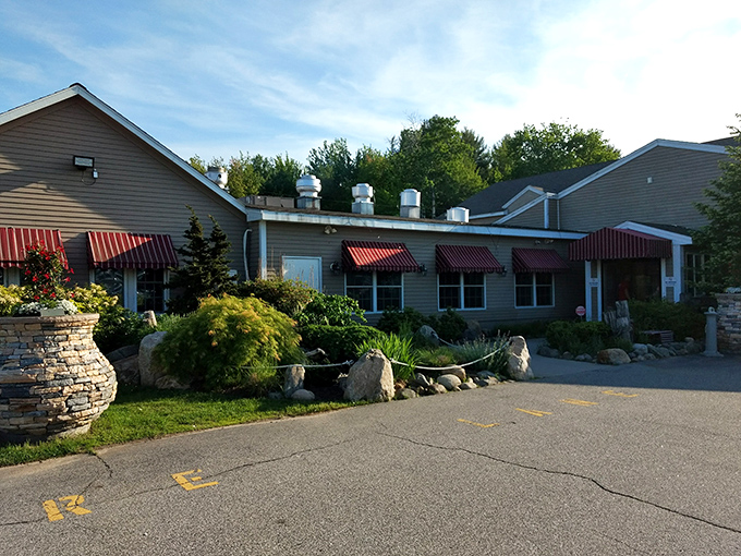 Welcome to seafood paradise! Mike's Clam Shack's modest exterior with charming red awnings belies the culinary treasures waiting inside.