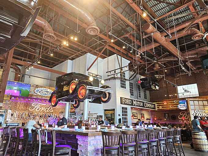 That's a full-sized tractor hanging from the ceiling, because Ford's Garage doesn't believe in doing anything halfway when it comes to automotive decor.