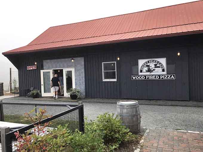 The unassuming black barn exterior hides pizza perfection inside, like Clark Kent hiding Superman under those glasses.