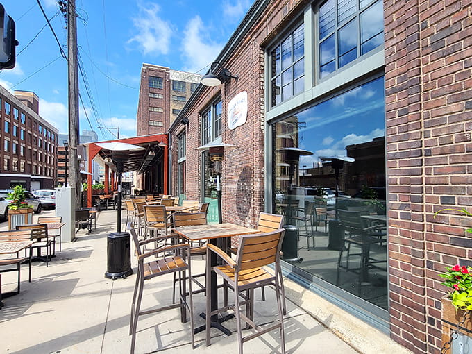 The inviting brick exterior and sunny patio seating promise the coastal feast waiting inside this Minneapolis seafood haven.