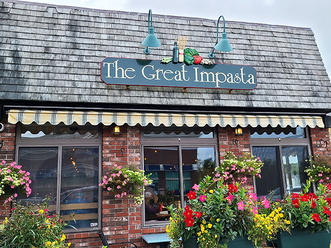 The Great Impasta's charming exterior welcomes pasta lovers with its brick facade, colorful flower boxes, and a promise of Italian-Maine fusion magic within.