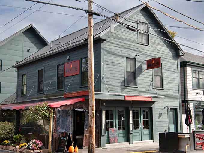 The charming exterior of Blaze beckons hungry travelers with its welcoming facade and prime Main Street location in Bar Harbor.