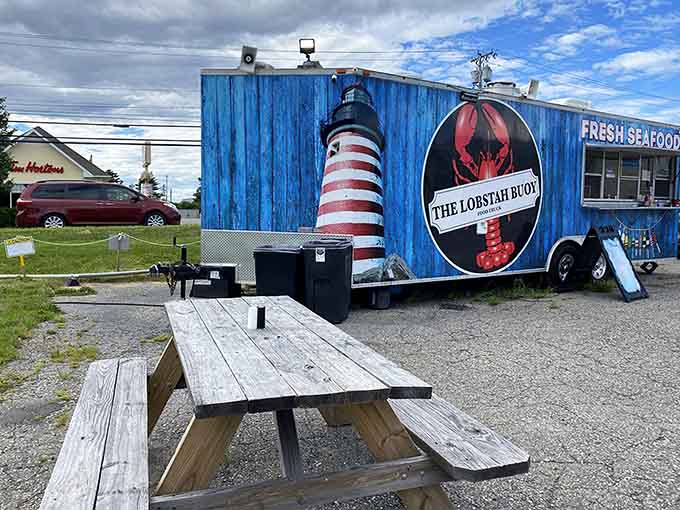 That bright blue food truck with the cheerful lighthouse isn't just photogenic, it's your gateway to some of the finest lobster rolls in Maine, proving that great things really do come in small packages.