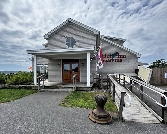 The unassuming exterior of Dolphin Marina & Restaurant proves that the best seafood spots don't need flashy signs to draw a crowd.