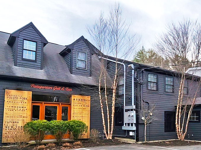 The charming exterior of The Lost Fire beckons with its dark shingles and warm wooden doors &ndash; a culinary adventure disguised as a country home.