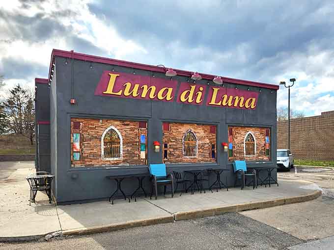 Luna di Luna's charming exterior beckons with its distinctive gray facade and decorative brick arches, promising Italian delights within.