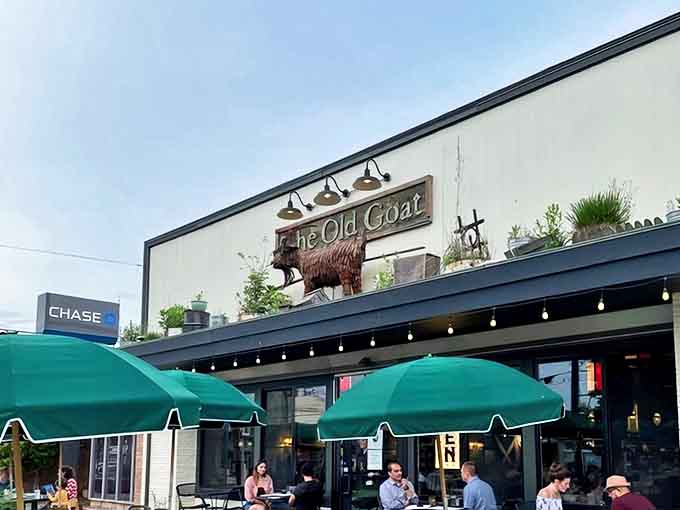 That quirky goat sculpture standing guard promises the flavor adventure waiting inside this Alger Heights treasure.