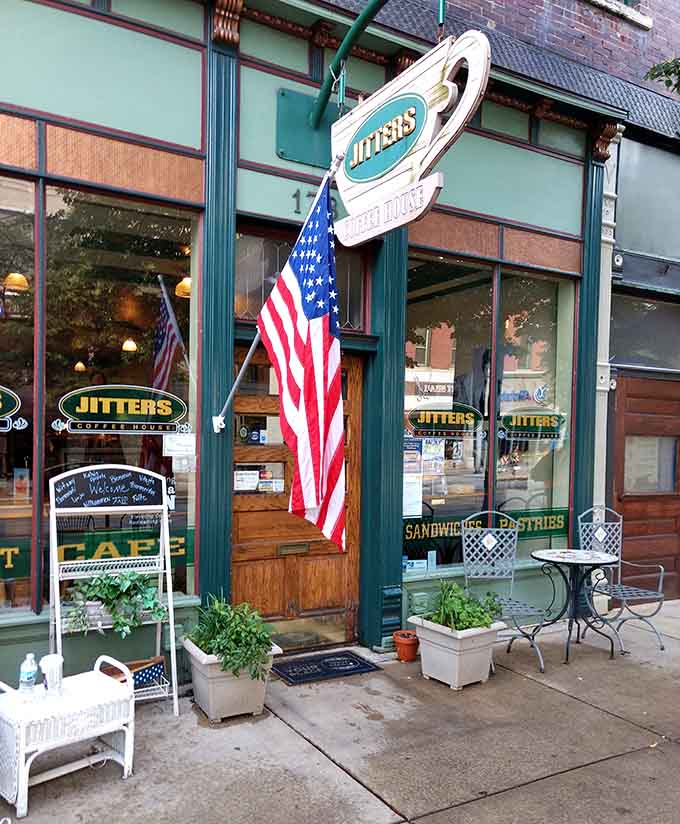 That American flag and charming storefront are basically waving you inside for pastries and possibility.