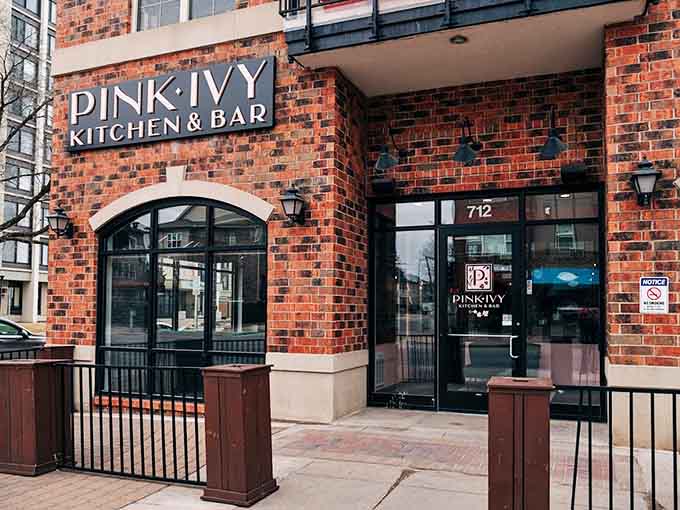 That charming brick exterior with the arched entrance practically begs you to come inside and see what all the fuss is about.