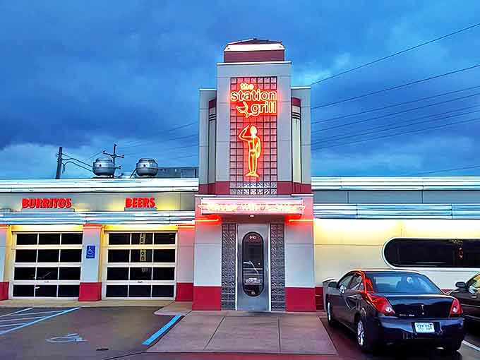 That Art Deco tower isn't just architectural eye candy, it's a delicious promise rising above West Broadway like a chrome-and-neon lighthouse guiding hungry souls to salvation.