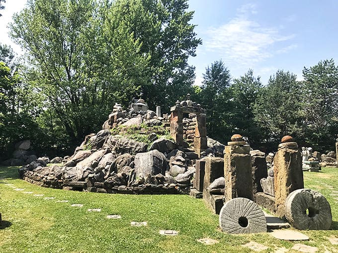 The Temple of Tolerance: Massive stone formations rise unexpectedly from a residential backyard, creating a sanctuary of peace and reflection in small-town Ohio.