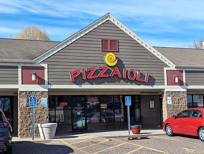 That cheerful yellow swirl beckons you toward wing nirvana, disguised as an unassuming strip mall tenant in Chanhassen.