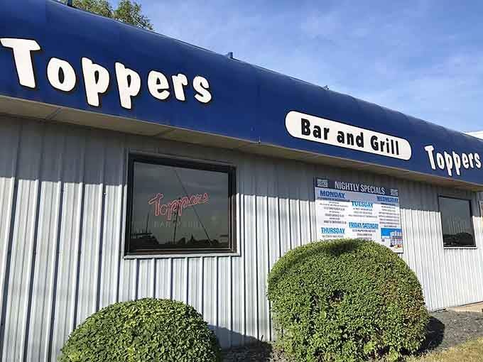 The unassuming exterior of Topper's Bar and Grill hides one of Minnesota's best-kept culinary secrets, where legendary wings await inside.