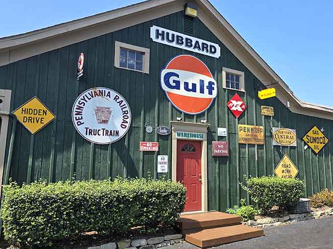 That green building isn't just playing dress-up with vintage signs; it's an actual Pennsylvania Railroad trolley car living its best diner life in Hubbard, Ohio.