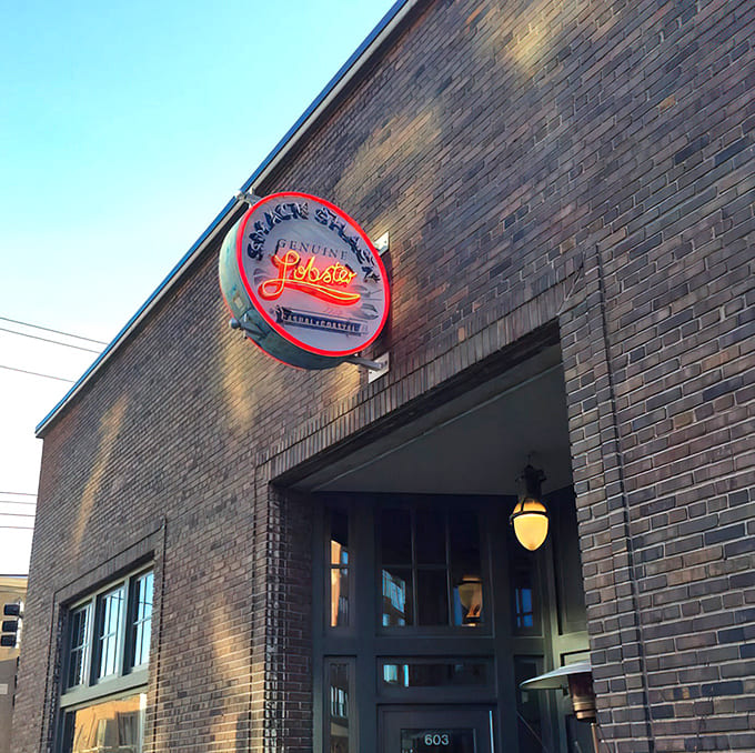That glowing sign beckons like a lighthouse for landlocked seafood lovers, promising coastal cuisine in the heart of Minneapolis.