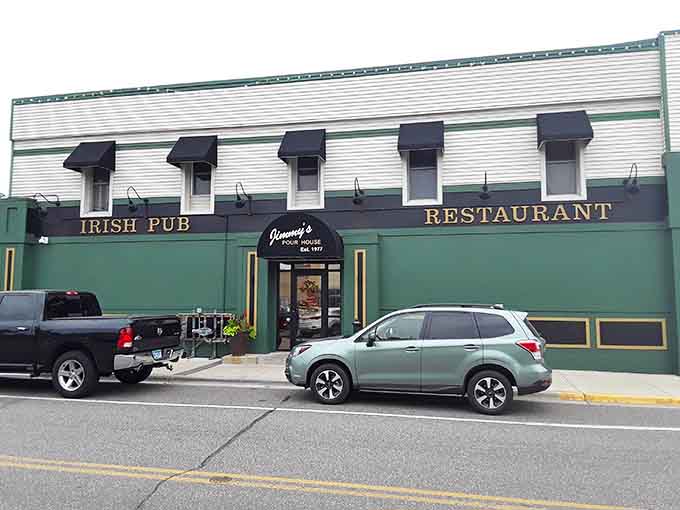 The green and white exterior of Jimmy's Pour House stands proud on 2nd Avenue, beckoning hungry travelers like a lighthouse guides ships to shore.