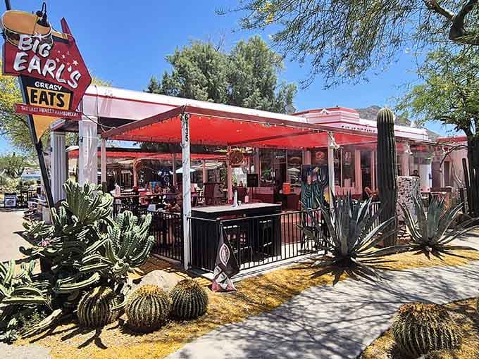 That vintage sign pointing toward burger paradise has been guiding hungry travelers to happiness for years now.