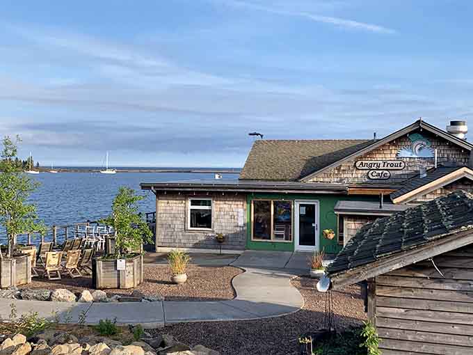 The Angry Trout Café sits waterside like it's been there forever, weathered shingles and all, proving the best restaurants don't need neon signs.