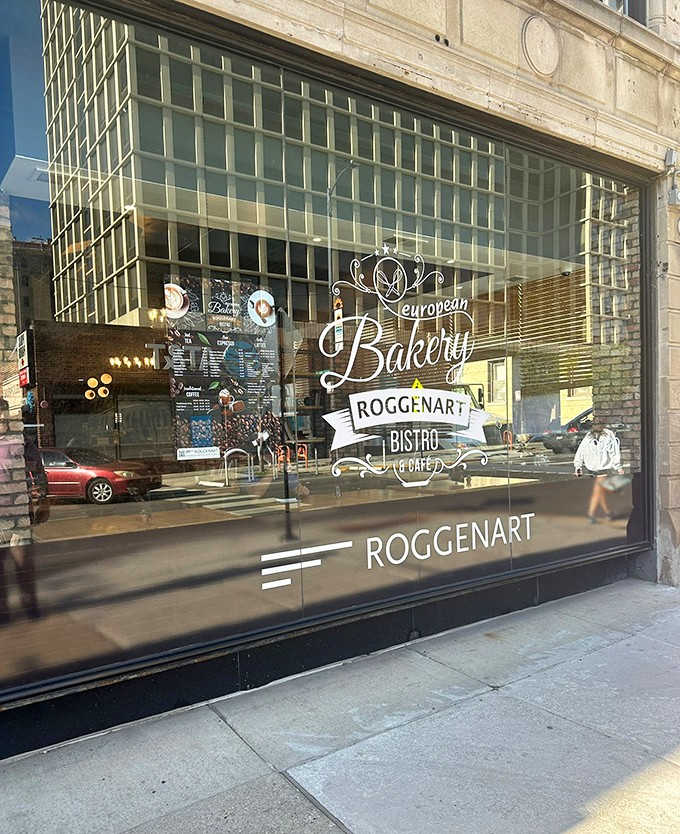 The elegant storefront of Roggenart European Bakery beckons passersby with promises of authentic European delights behind its gleaming windows.