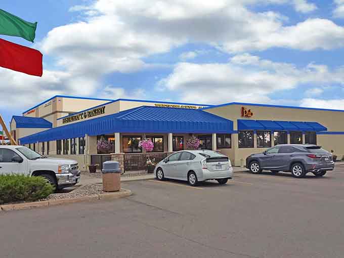 That blue awning marks the spot where highway travelers discover that gas stations can harbor serious baking talent.
