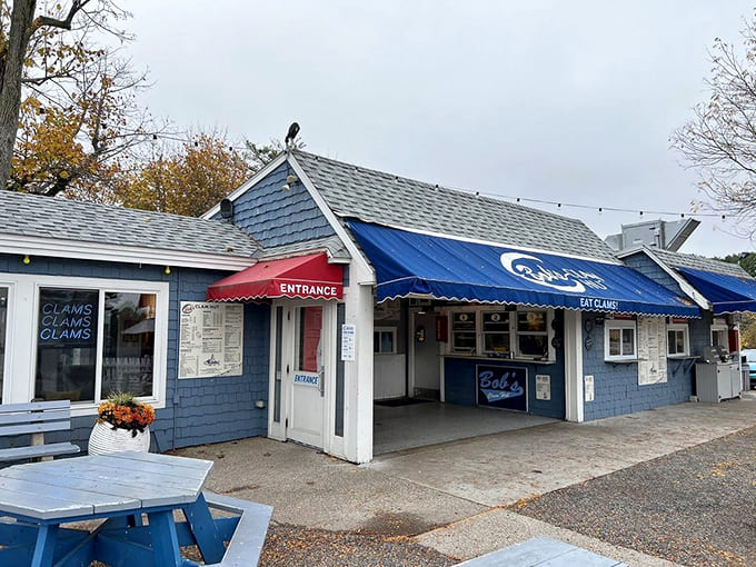 The unassuming blue exterior hides one of America's most legendary fried clam operations, proving great food doesn't need fancy packaging.