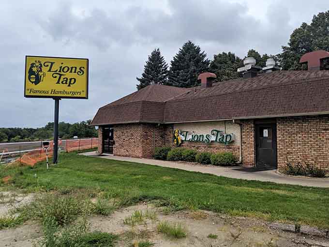 That cheerful yellow sign beckoning from the roadside has guided hungry travelers to burger paradise for generations, a beacon of hope for those seeking honest food.