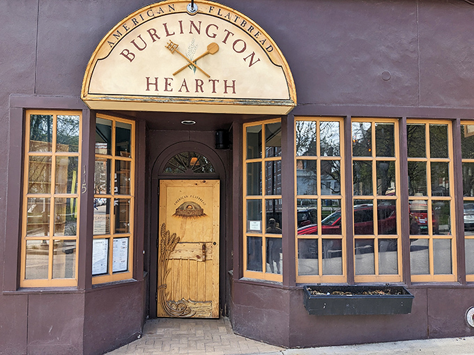 The entrance to American Flatbread Burlington Hearth beckons like a portal to pizza paradise. That hand-carved wooden door practically whispers "deliciousness awaits inside."