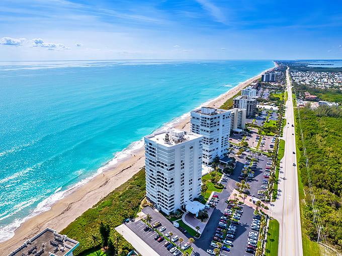 Turquoise waters meet pristine shoreline in this aerial view of Jensen Beach, where high-rises take a backseat to natural beauty and endless horizon.