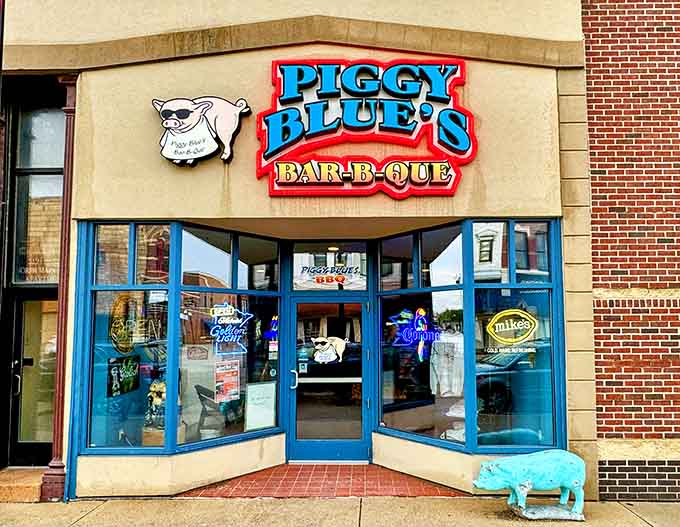 That cheerful blue pig statue isn't just decoration, it's your first clue that serious barbecue awaits inside this Austin gem.