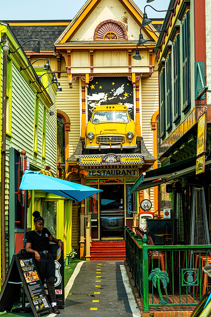 A vintage yellow taxi cab bursts through the fa&ccedil;ade of Route 66 Restaurant, creating Bar Harbor's most eye-catching storefront entrance.
