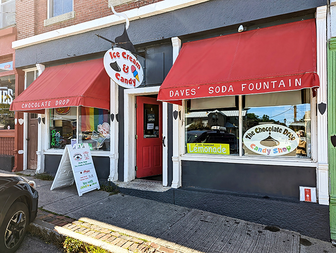 Exterior: The red awnings of The Chocolate Drop beckon like sweet sirens, promising a sugar rush that no diet plan can withstand.