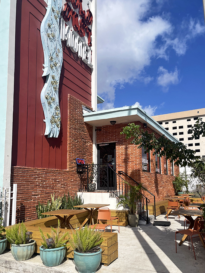 The brick-and-mortar magic factory where St. Petersburg's wing obsession begins &ndash; Mad Radio's exterior promises culinary adventures behind that distinctive sign.