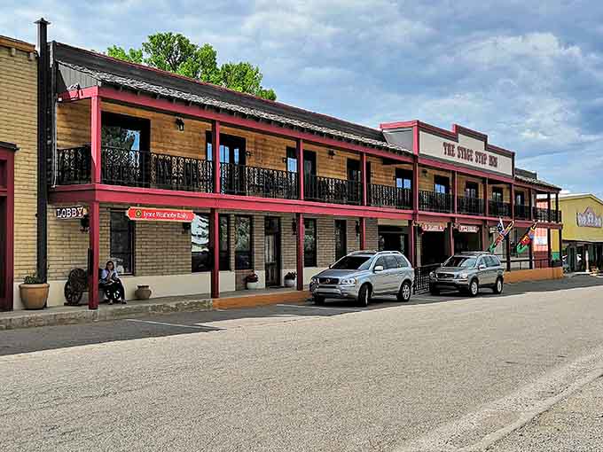 The Stage Stop Inn's pink-trimmed facade looks like the Old West had a baby with a candy store, and honestly, we're here for it.
