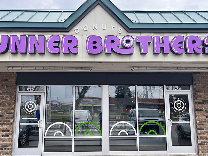 That purple signage isn't just decoration, it's a beacon calling donut lovers home to their happy place.
