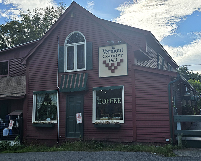A charming maroon clapboard building with green trim &ndash; the Vermont Country Deli stands ready to exceed all your culinary expectations.