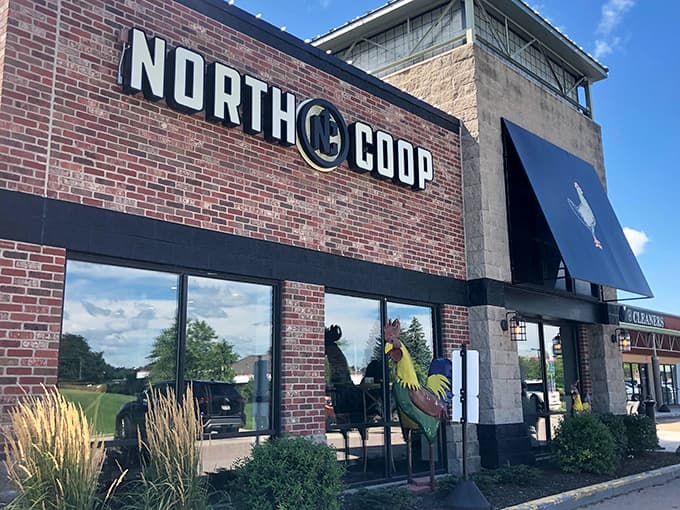 The charming exterior welcomes diners with rustic brick and a proud rooster, promising Southern comfort in Minnesota's heartland.