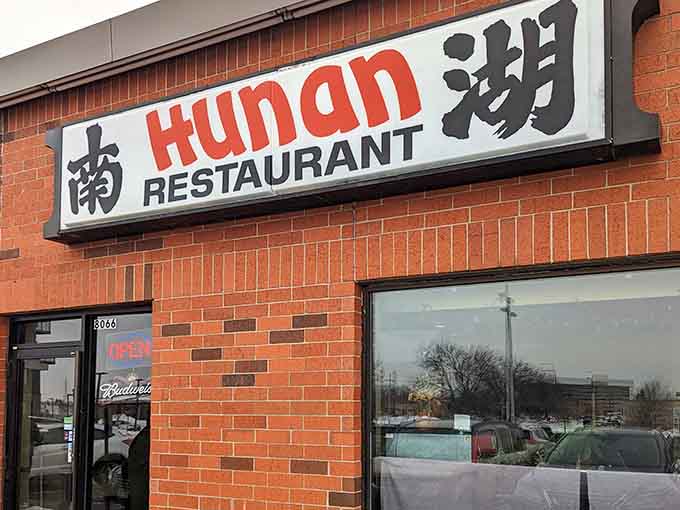 The unassuming brick exterior hides culinary treasures that locals have been quietly enjoying for years while the rest of us drove right past.