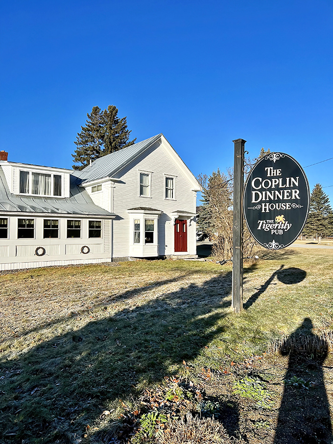 Classic New England charm greets visitors at The Coplin Dinner House, where culinary magic happens behind that unassuming white facade.