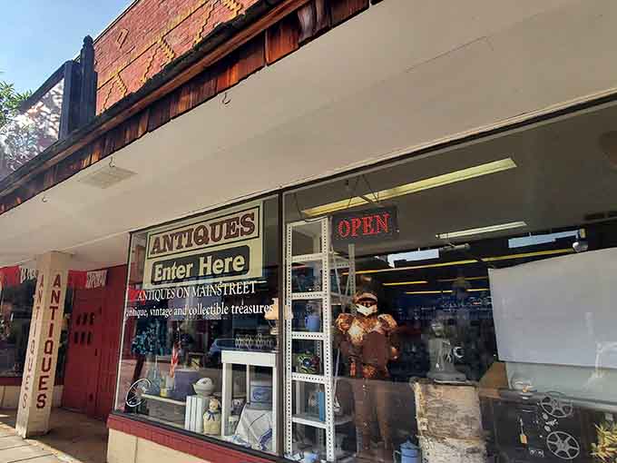 The unassuming storefront beckons like a portal to yesterday, where "Enter Here" means stepping into decades of accumulated wonder and whimsy.