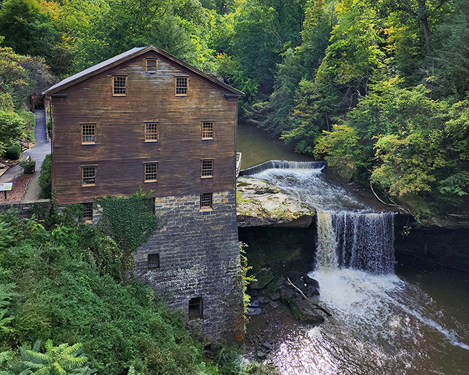 Lanterman's Mill stands proudly beside cascading waters, a wooden sentinel that's been grinding grain since 1845.