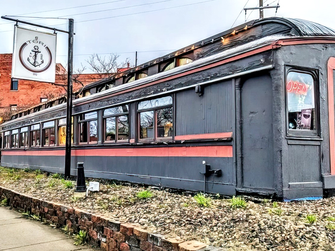 The vintage railcar exterior of Tori Ramen stands proudly on West 7th Street, its dark body and red stripe promising culinary adventures within.